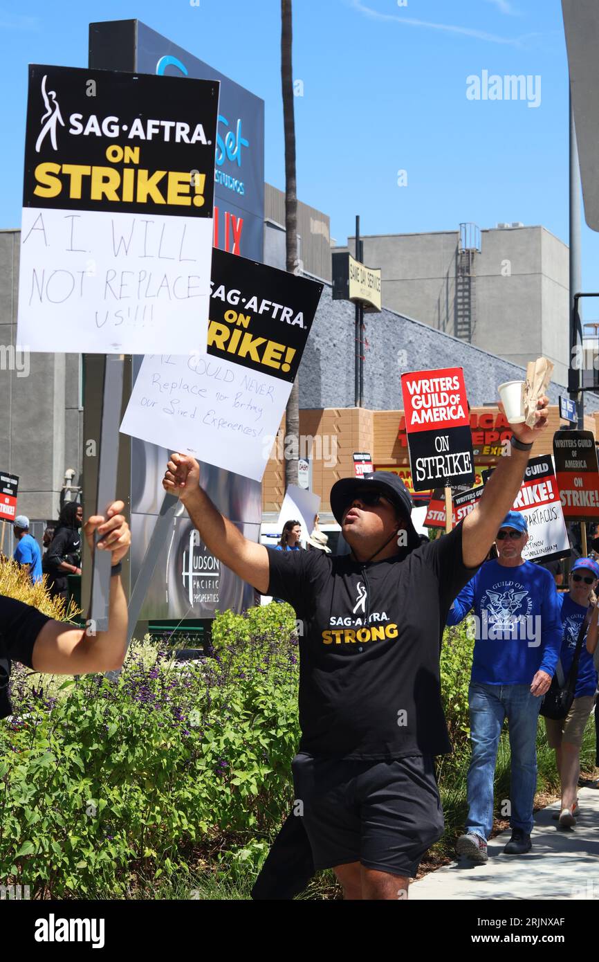The AFTRA union members start day one of their strike, and march on the ...