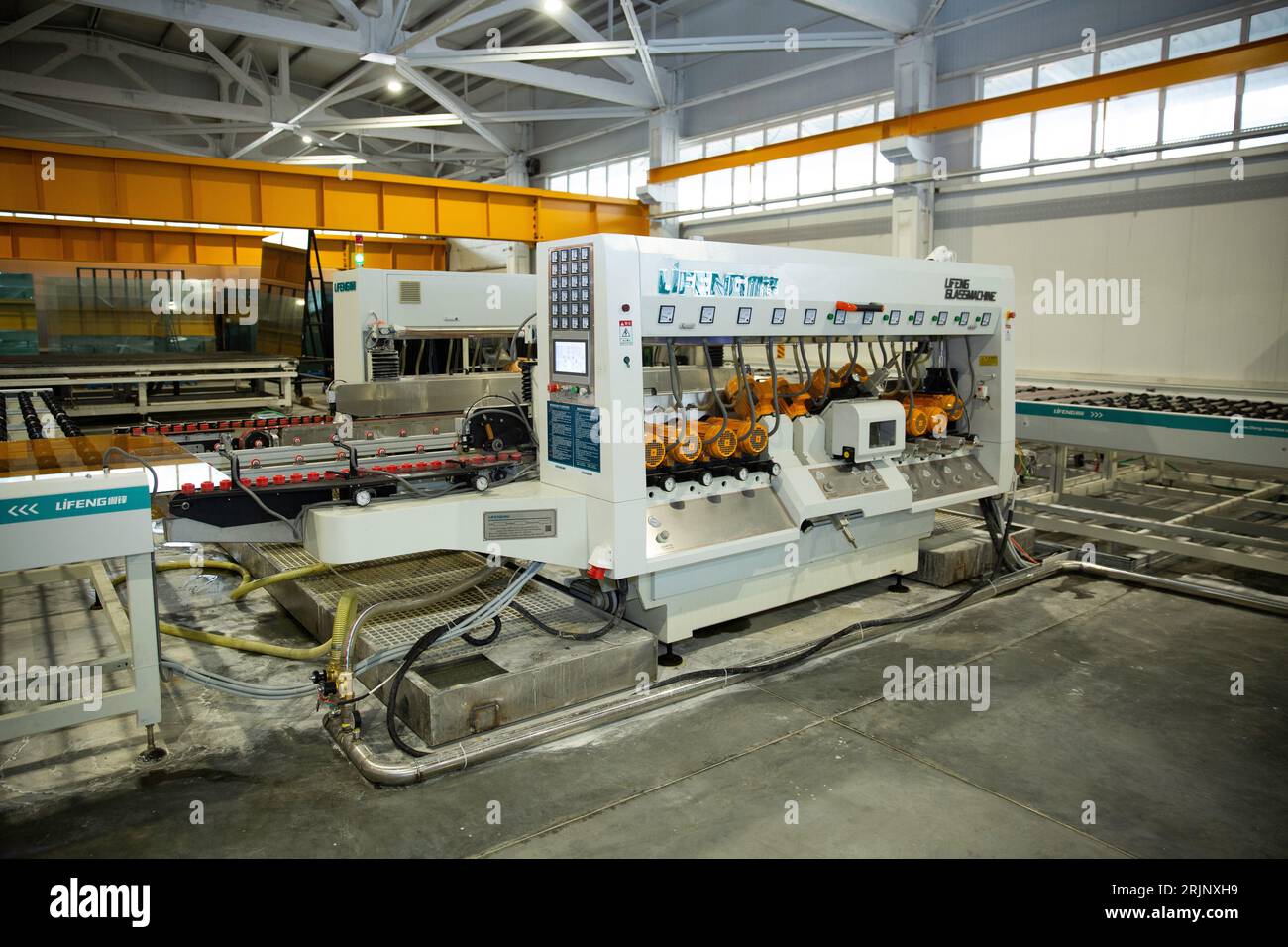 A group of industrial machines working together in a production factory ...