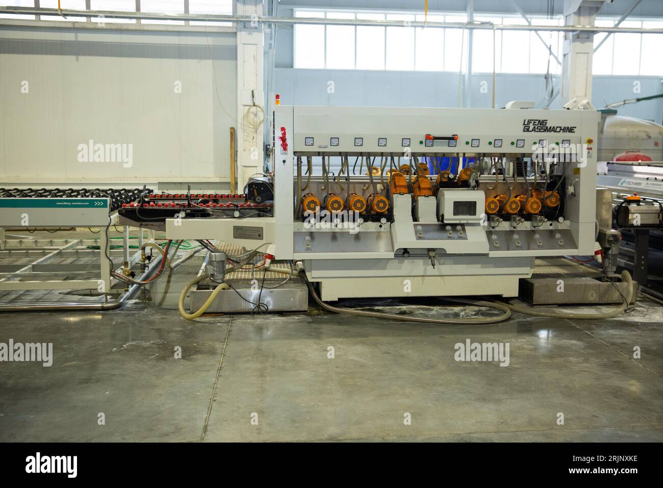 A group of industrial machines working together in a production factory ...