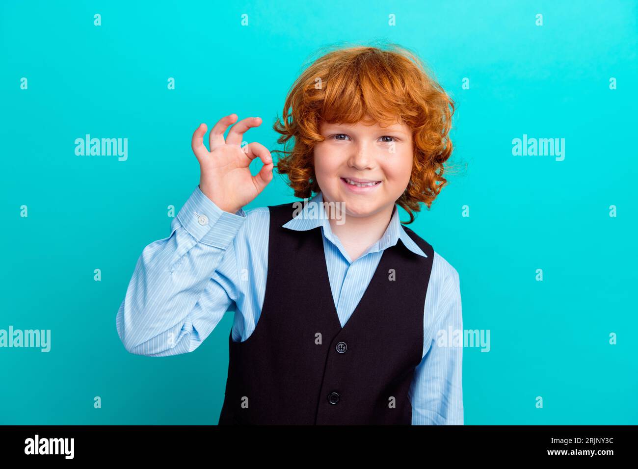 Photo portrait of adorable foxy wavy hair boy showing okey symbol ...