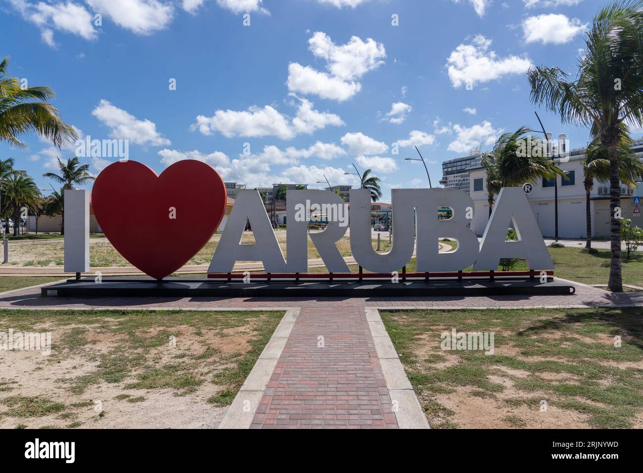A sign with the words 'I Love Aruba' is visible at the entrance of a ...