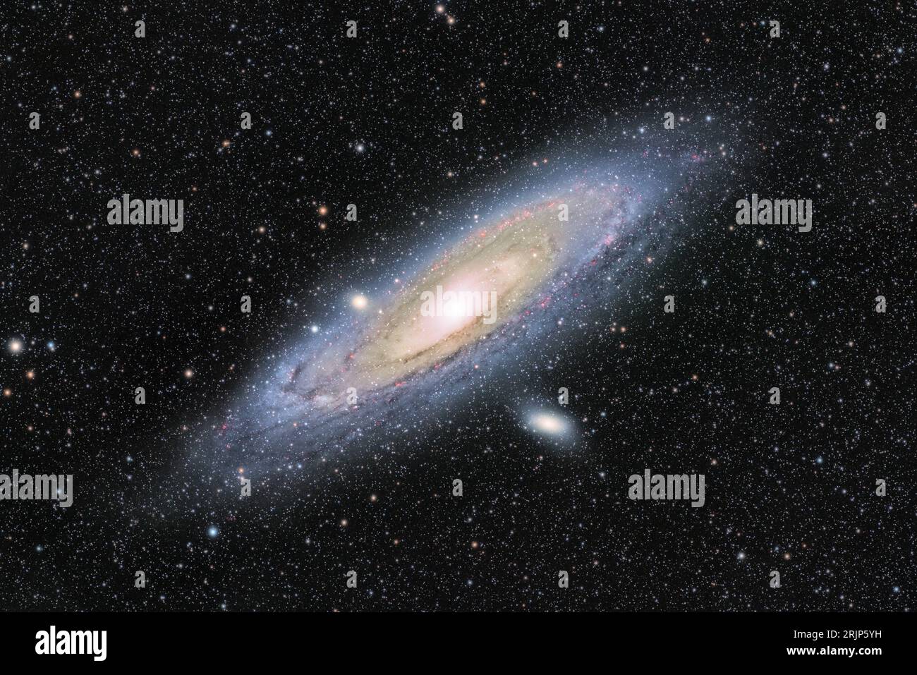 A breathtaking astrophotography of a barred spiral galaxy, with wispy ...