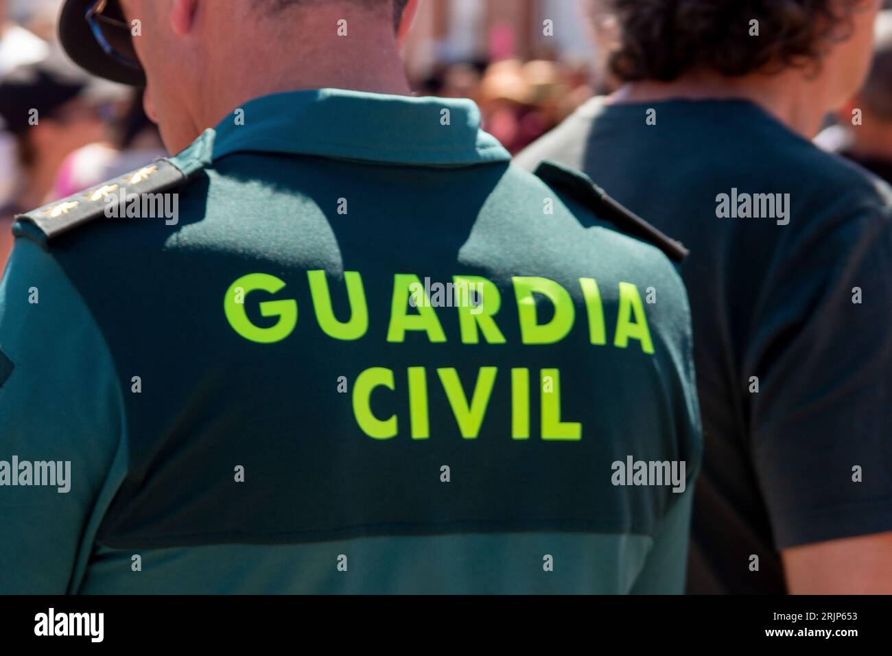 Police back, Civil Guard sign can be seen on the shirt Stock Photo - Alamy