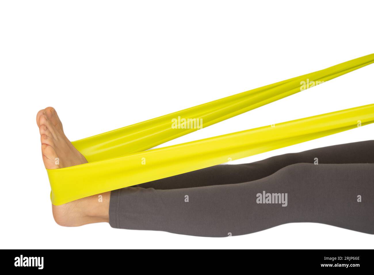 The girl is engaged in fitness with a fitness elastic band on a white ...