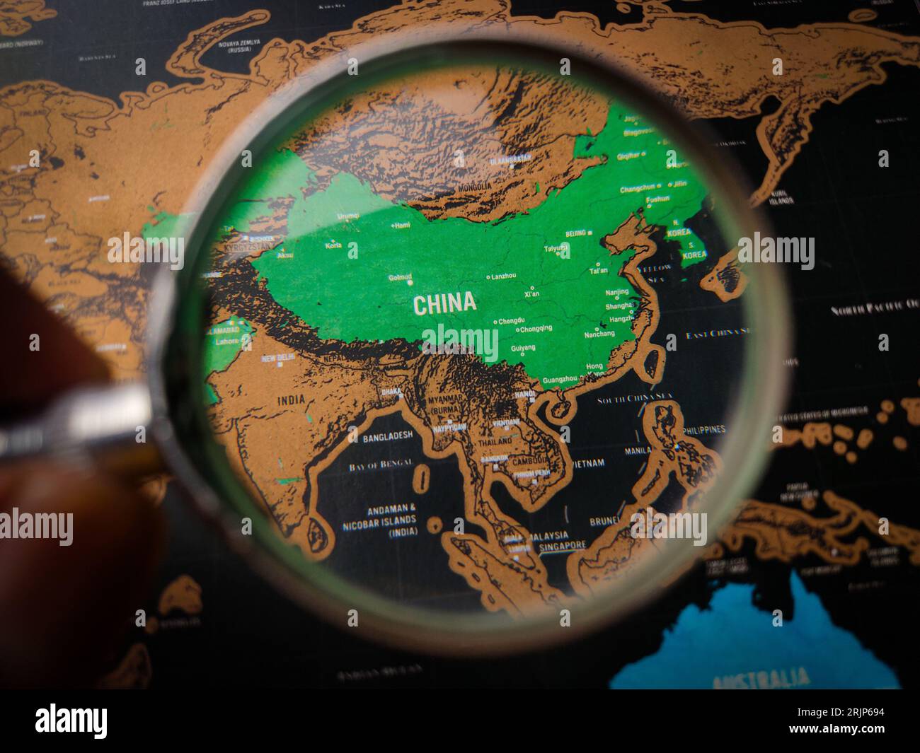 Top view hand holding magnifying glass and focus to CHINA map Stock ...