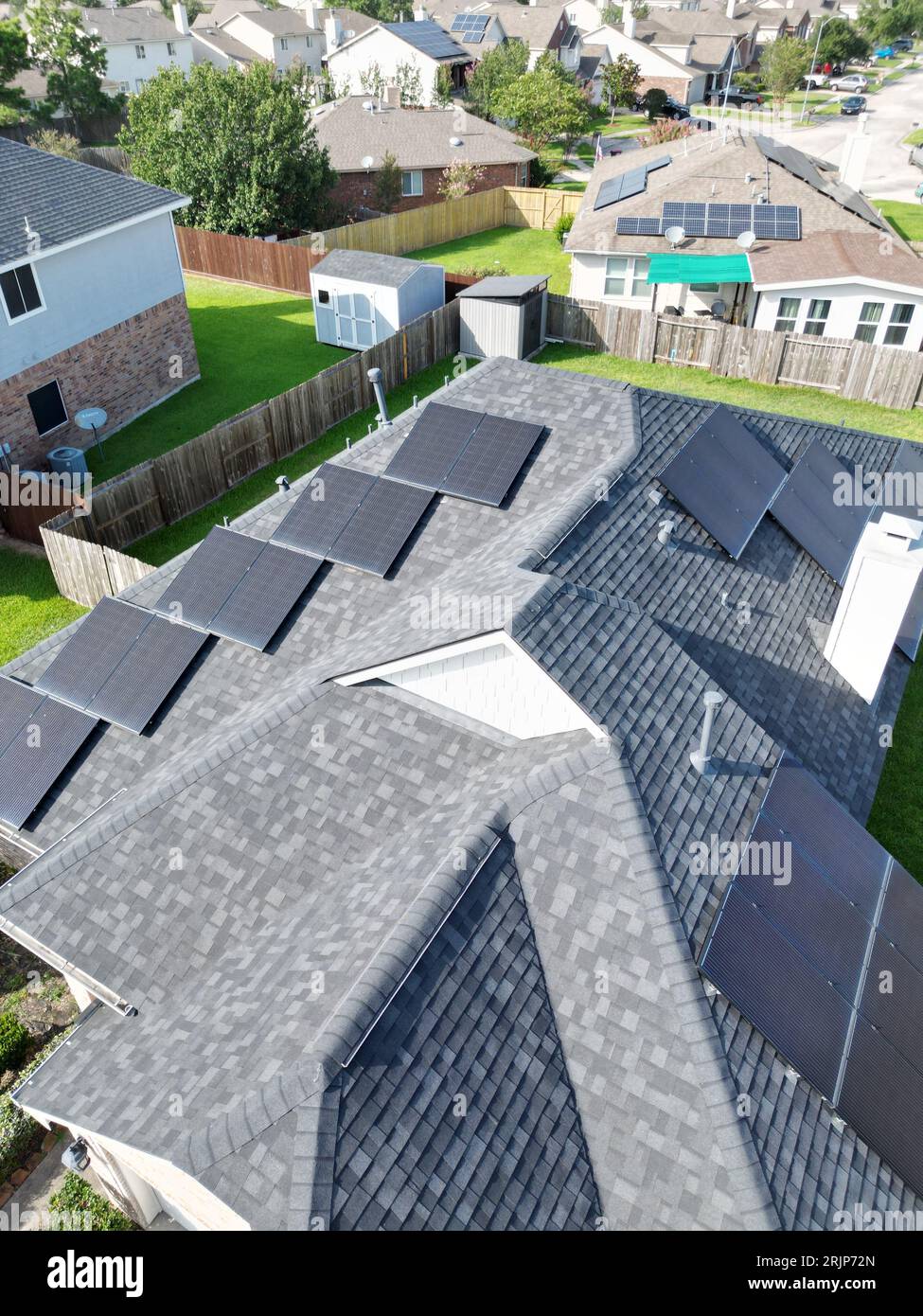 An aerial view of suburban homes in a residential neighborhood with ...
