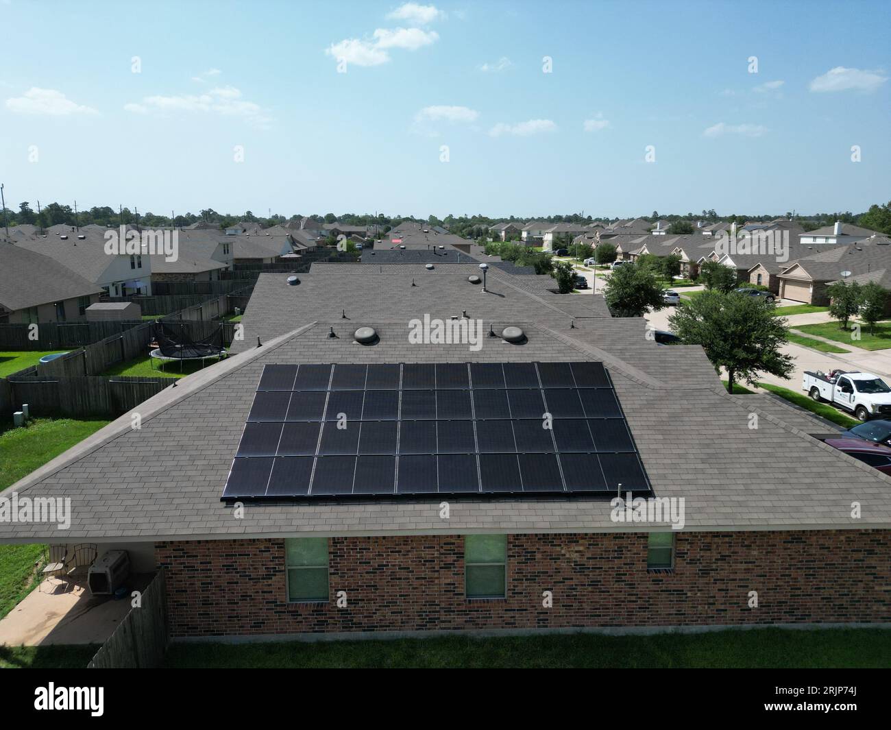 An aerial view of suburban homes in a residential neighborhood with ...