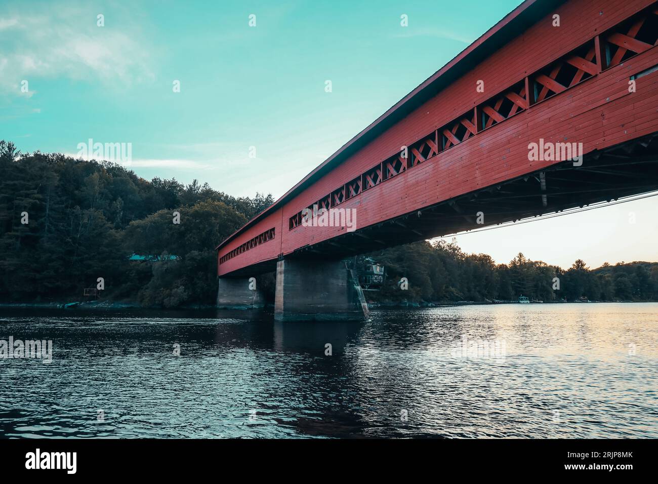 The picturesque covered red bridge in the village of Wakefield, Quebec ...