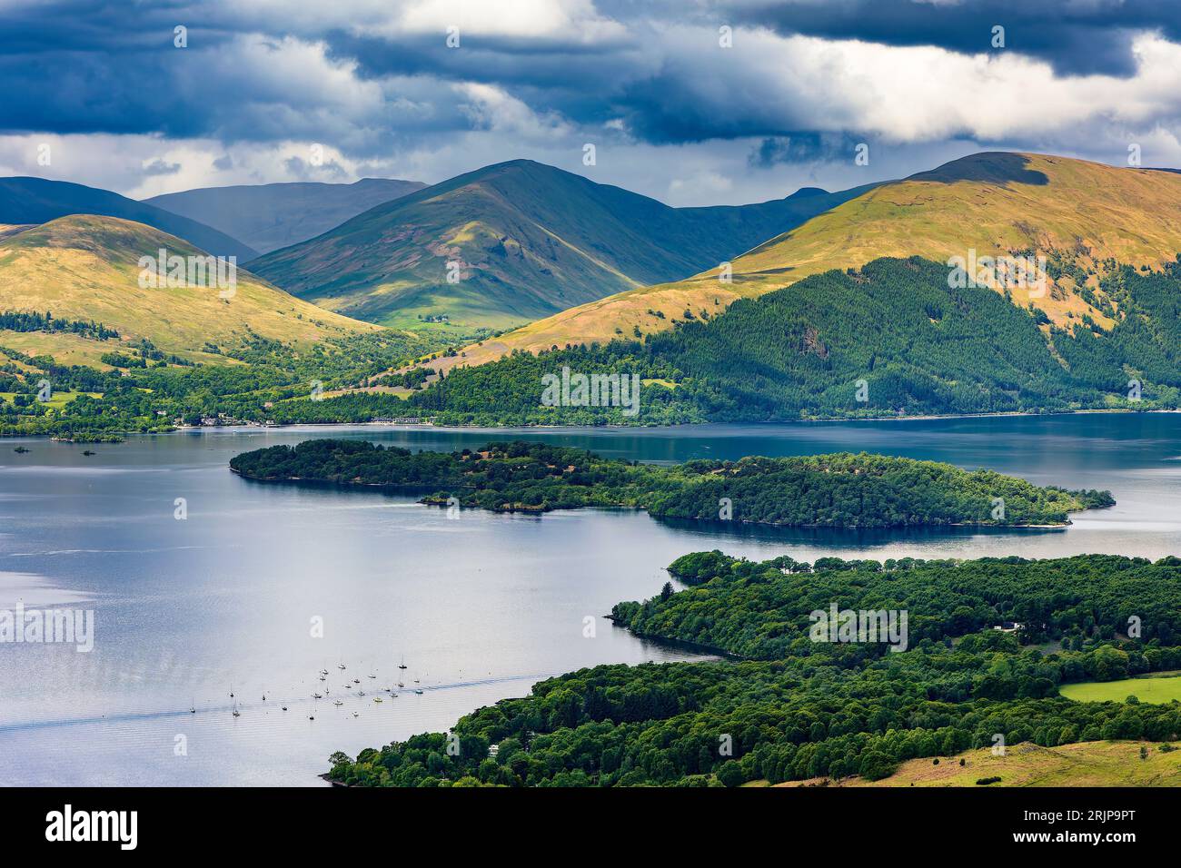 Beautiful Scottish Loch (Lake) with islands surrounded by mountains and ...