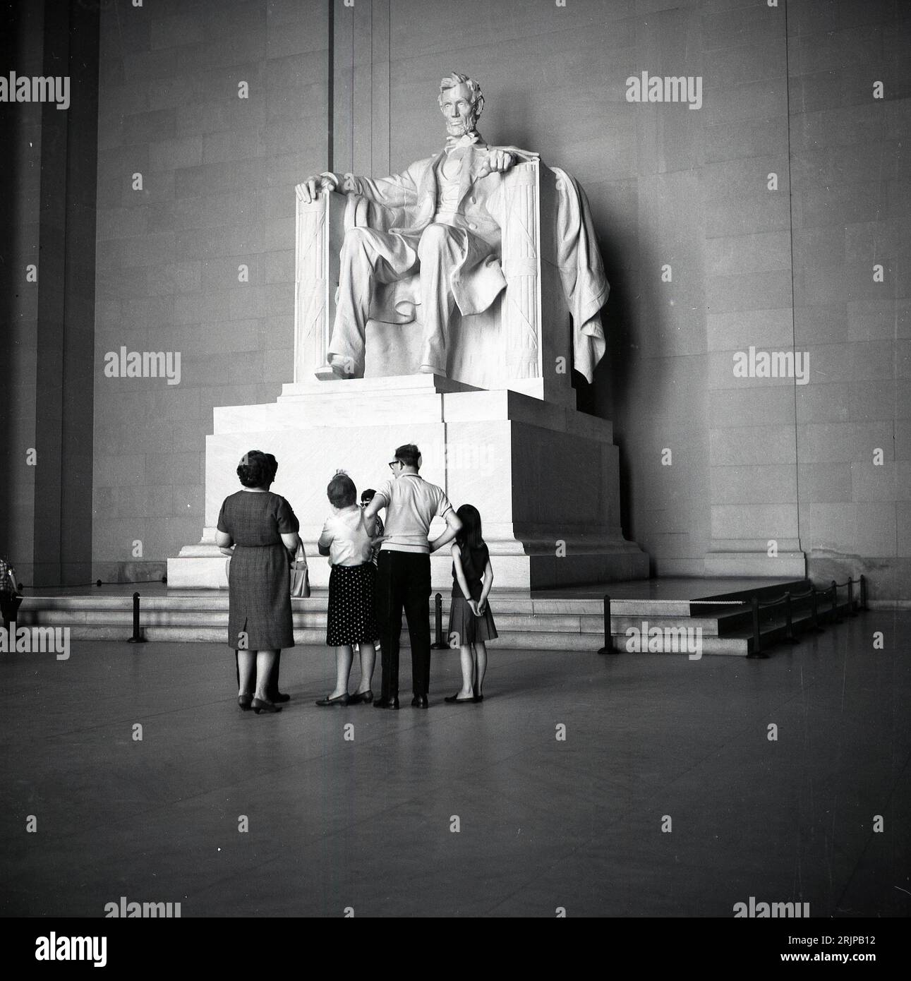 1960s, historical, a family looking at the statue of Arabham Lincoln ...