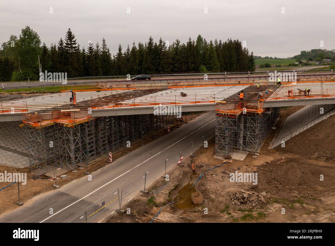 Drone photography of highway bridge being built during spring day. High ...