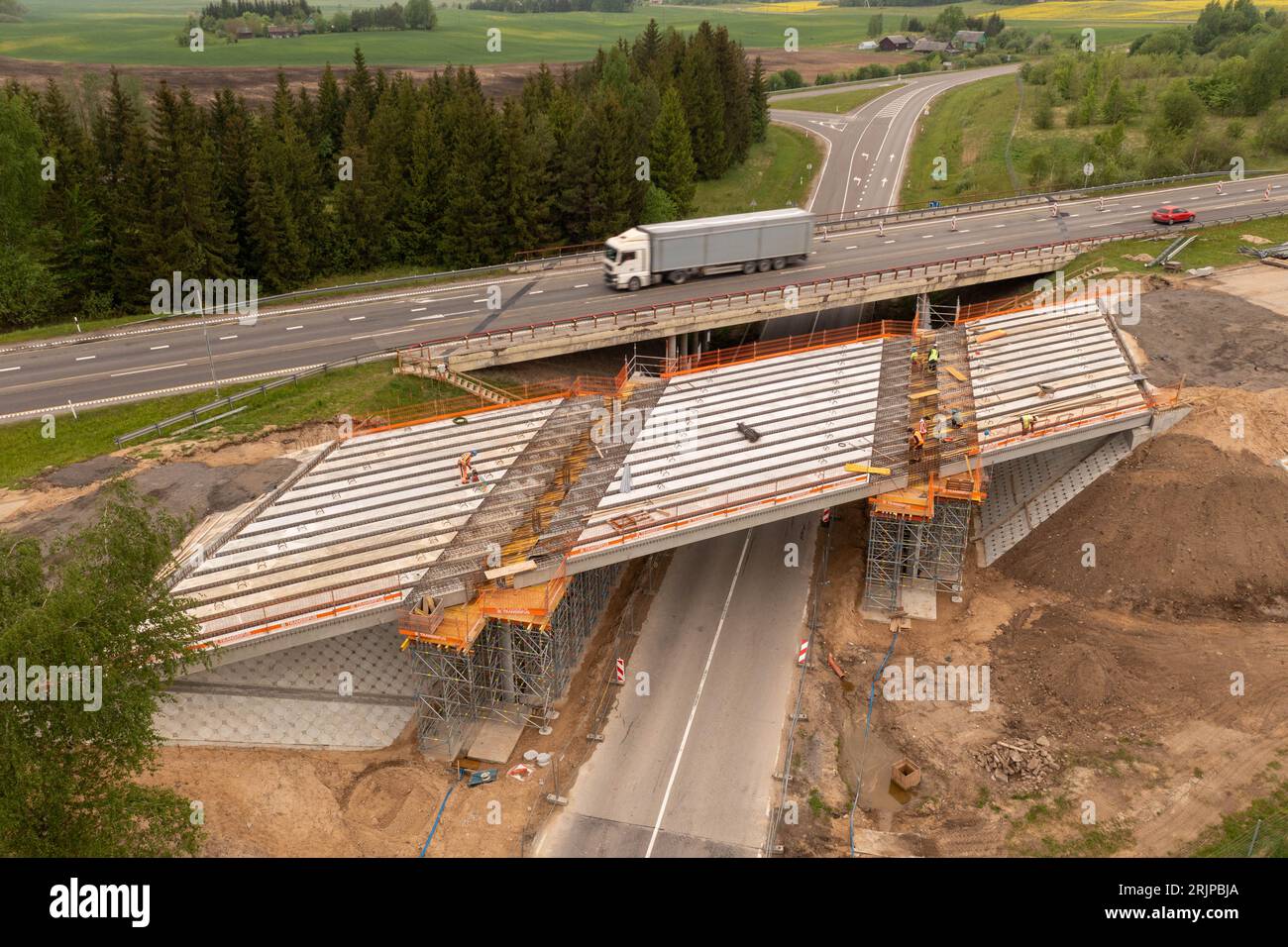 Drone photography of highway bridge being built during spring day. High ...