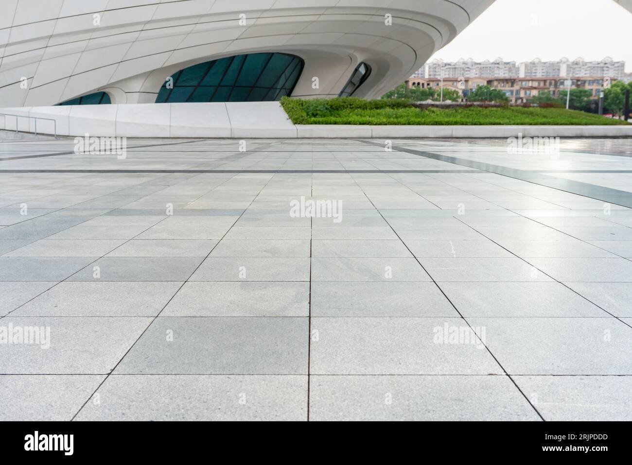 An urban cityscape featuring an empty ground floor with modern office ...