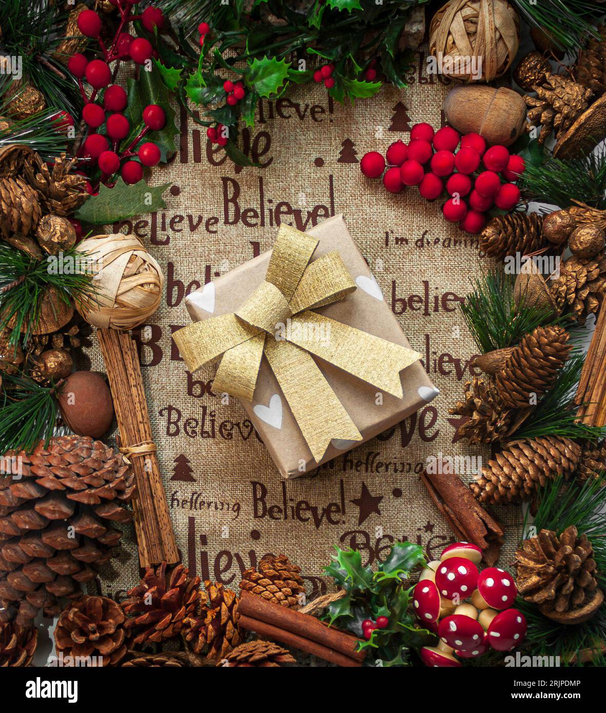 Christmas themed flat lay around a wrapped present Stock Photo - Alamy