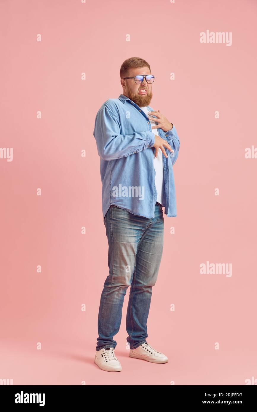 Full-length image of bearded man in casual clothes standing with ...