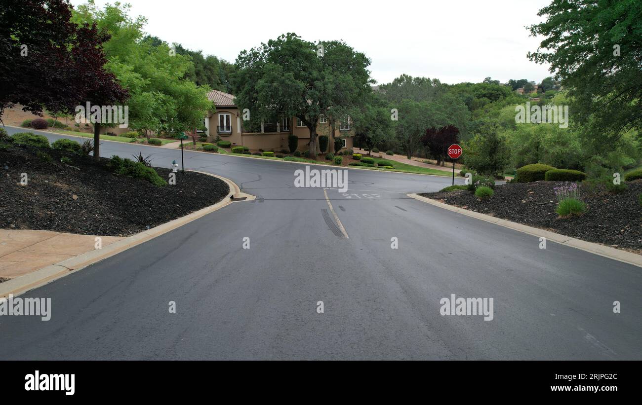 A stop sign with two roads branching off in opposite directions Stock ...