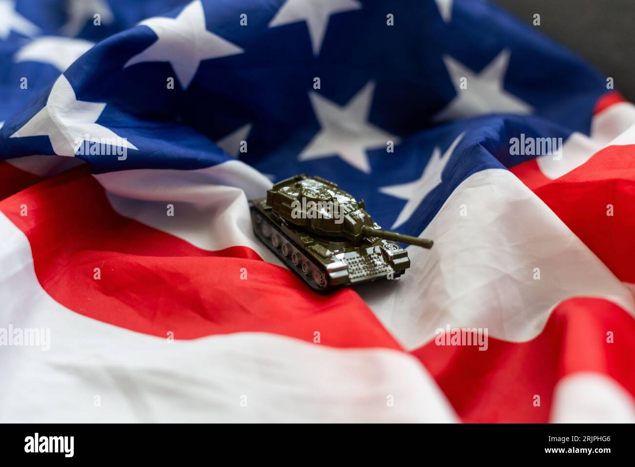 Toy model tank on USA national flag Stock Photo - Alamy