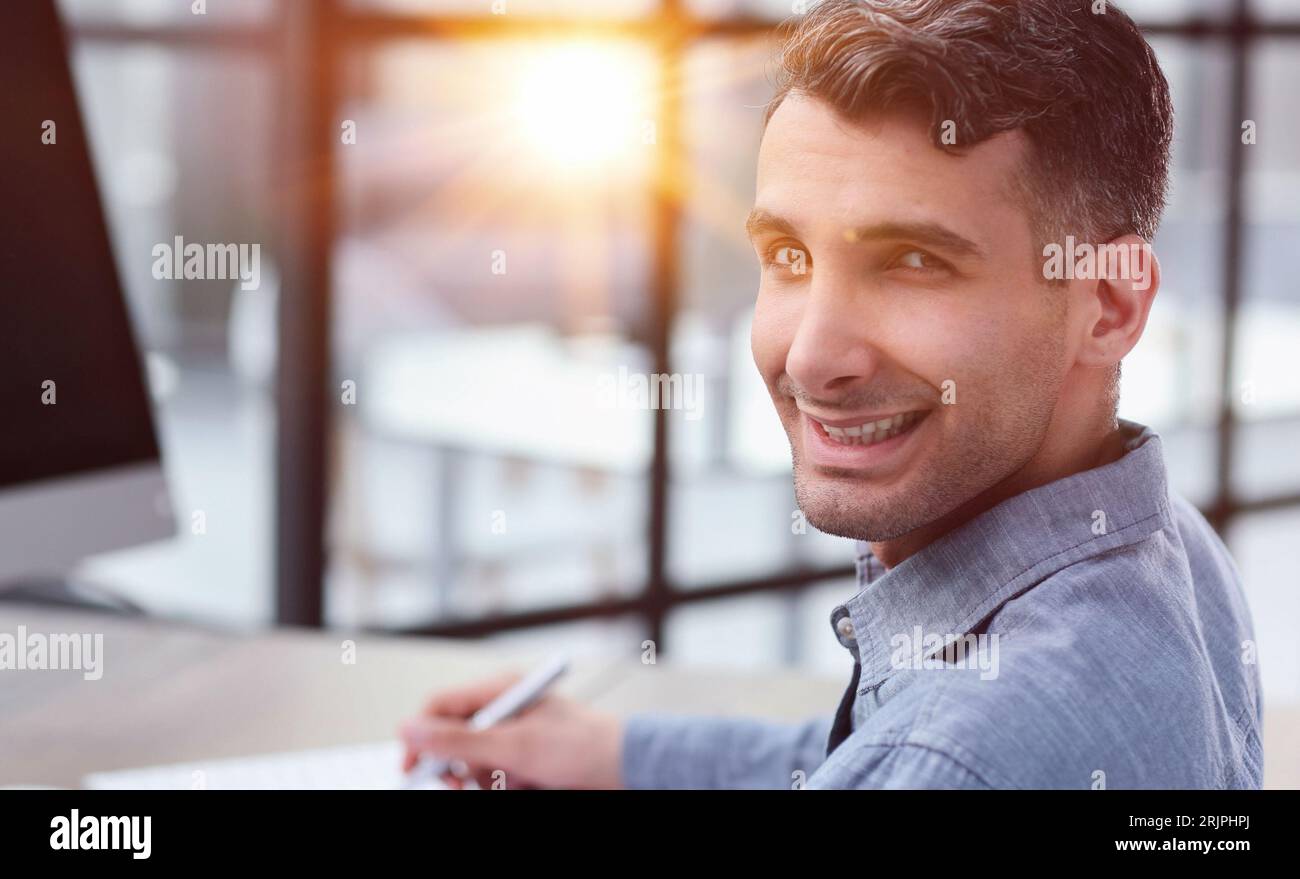 Portrait happy professor sitting desk hi-res stock photography and ...