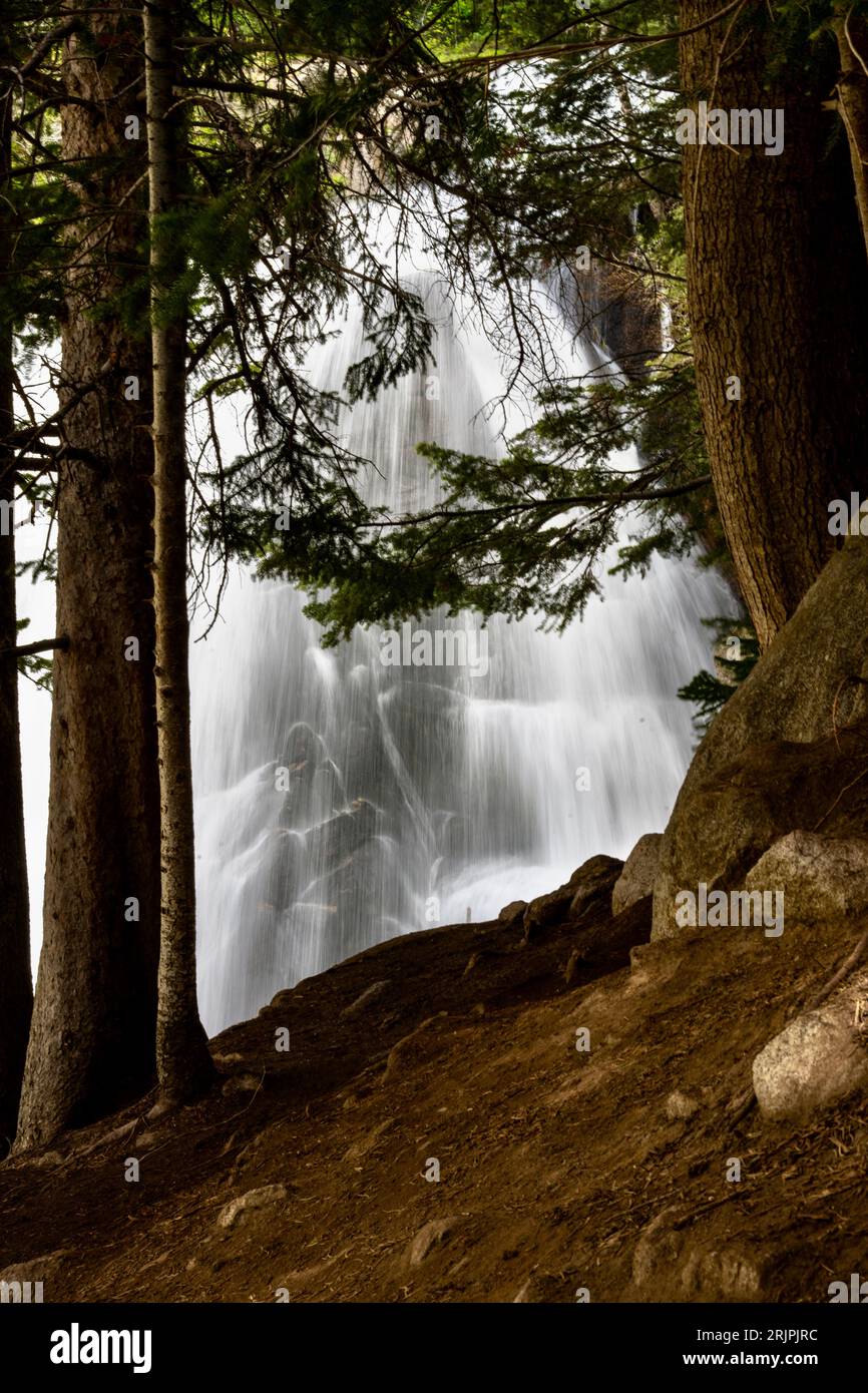 A breathtaking view of a majestic waterfall cascading down a rugged ...