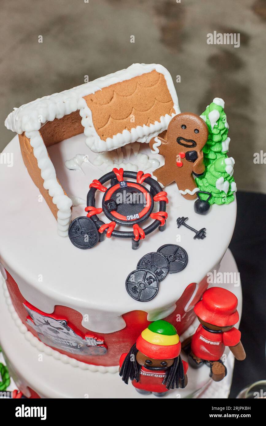 An image of a festive Christmas cake, featuring a shaped gingerbread ...