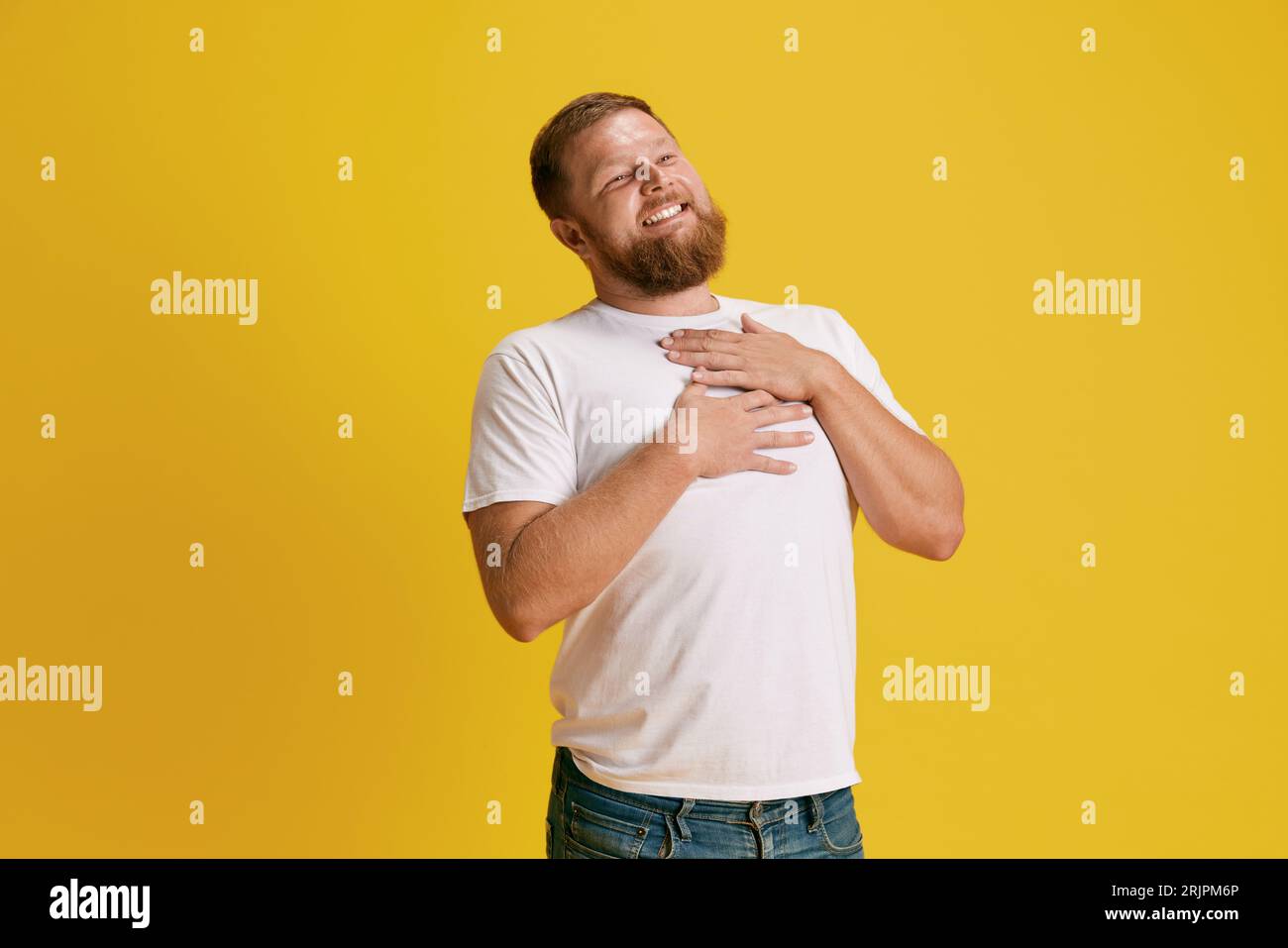 Handsome, smiling, positive bearded man feeling happy and delightful ...