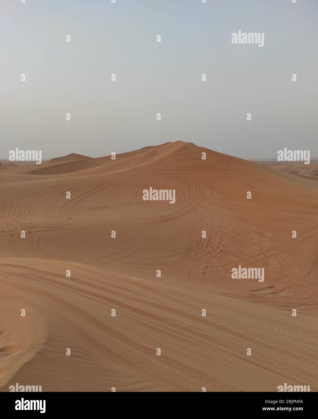 Sand dunes at Dubai desert at sunset. Summer holiday Stock Photo - Alamy