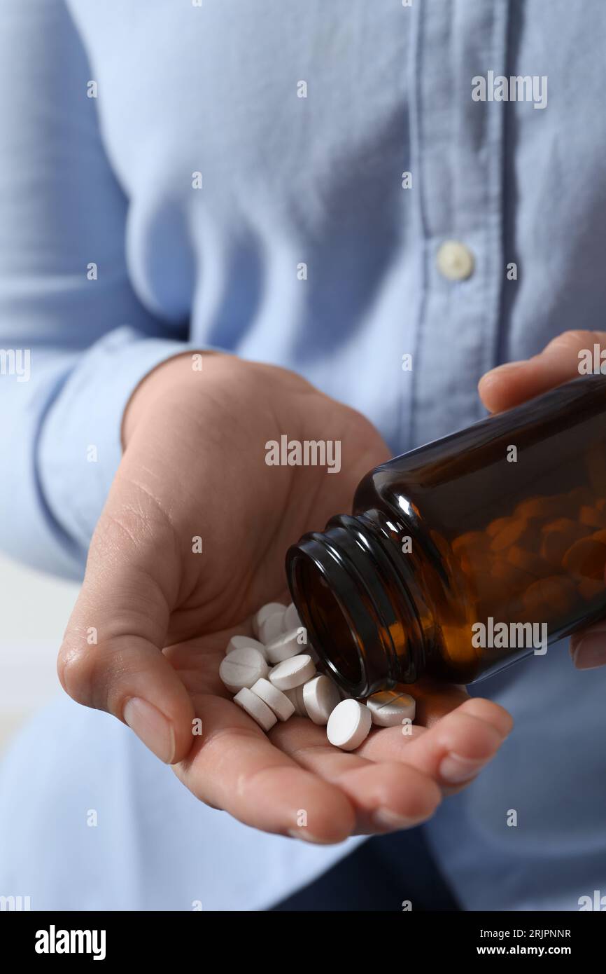 Woman pouring pills from hi-res stock photography and images - Alamy