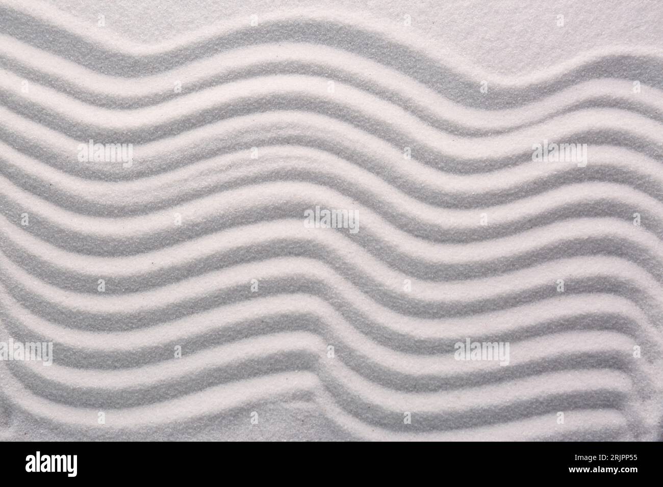 White sand with pattern as background, top view. Concept of zen and ...