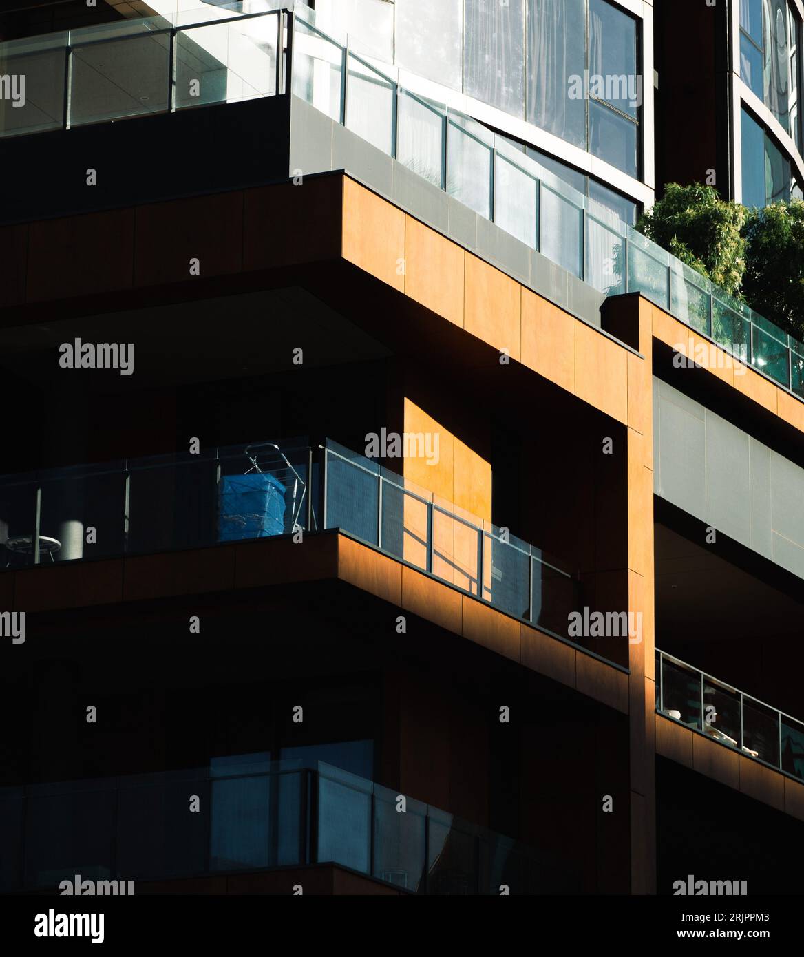 A modern building with a unique architecture featuring large glass ...