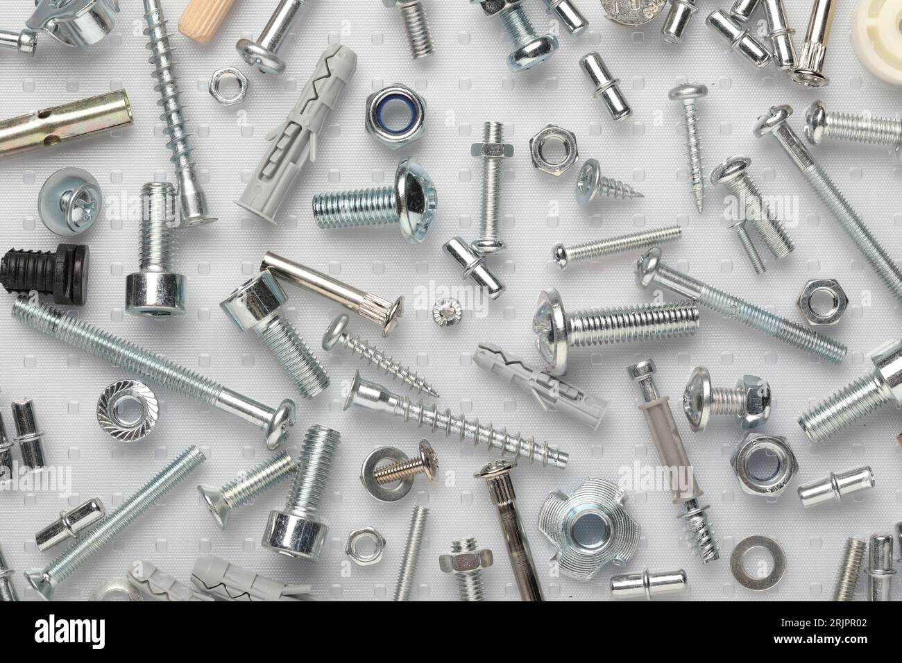 Many different fasteners on plastic surface, flat lay Stock Photo - Alamy