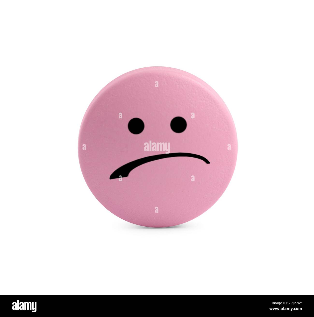 Pink pill with sad face on white background Stock Photo - Alamy