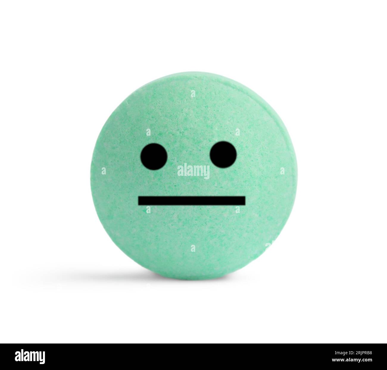 Green pill with neutral face on white background Stock Photo - Alamy