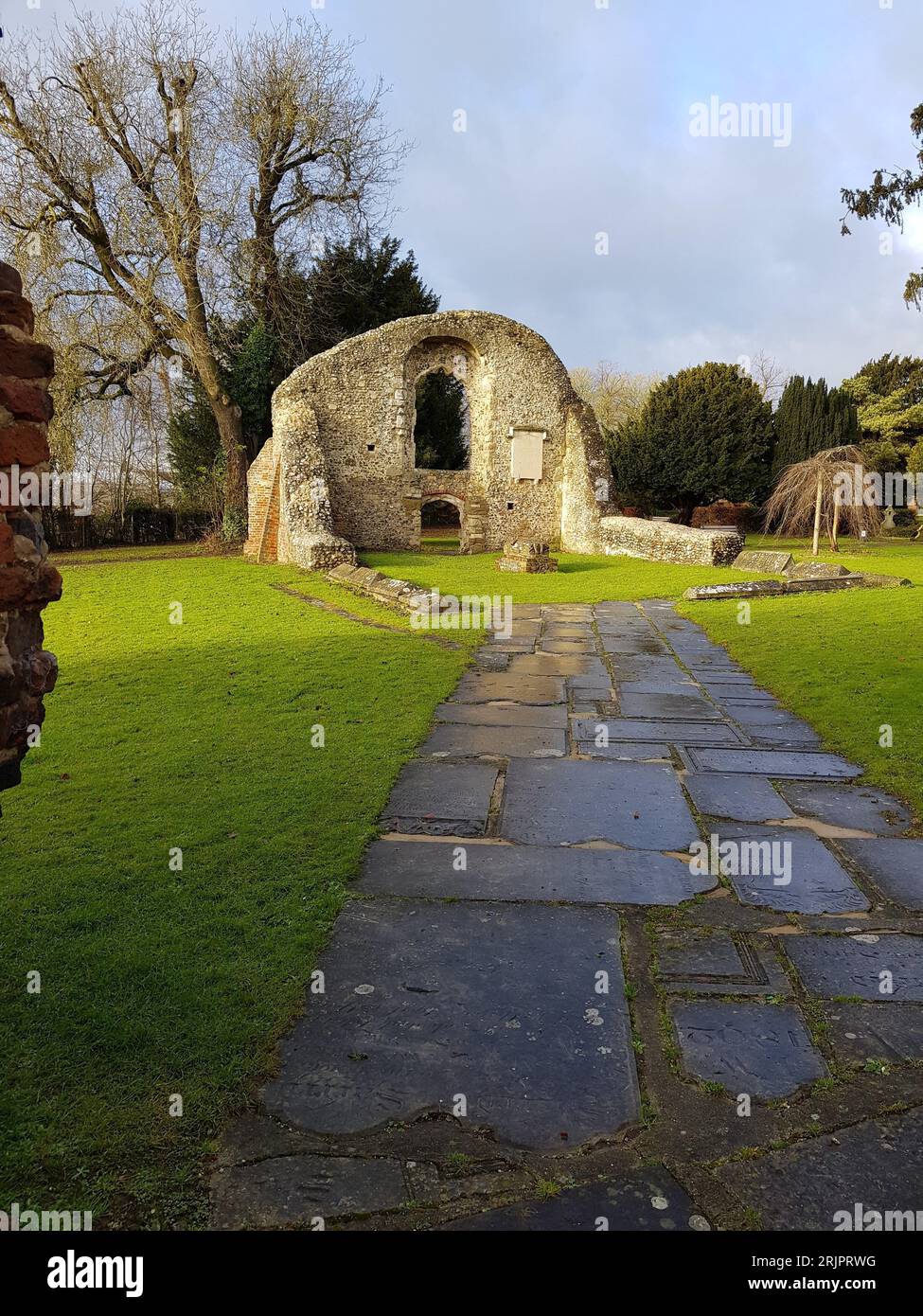A tranquil outdoor courtyard featuring a large stone centerpiece ...