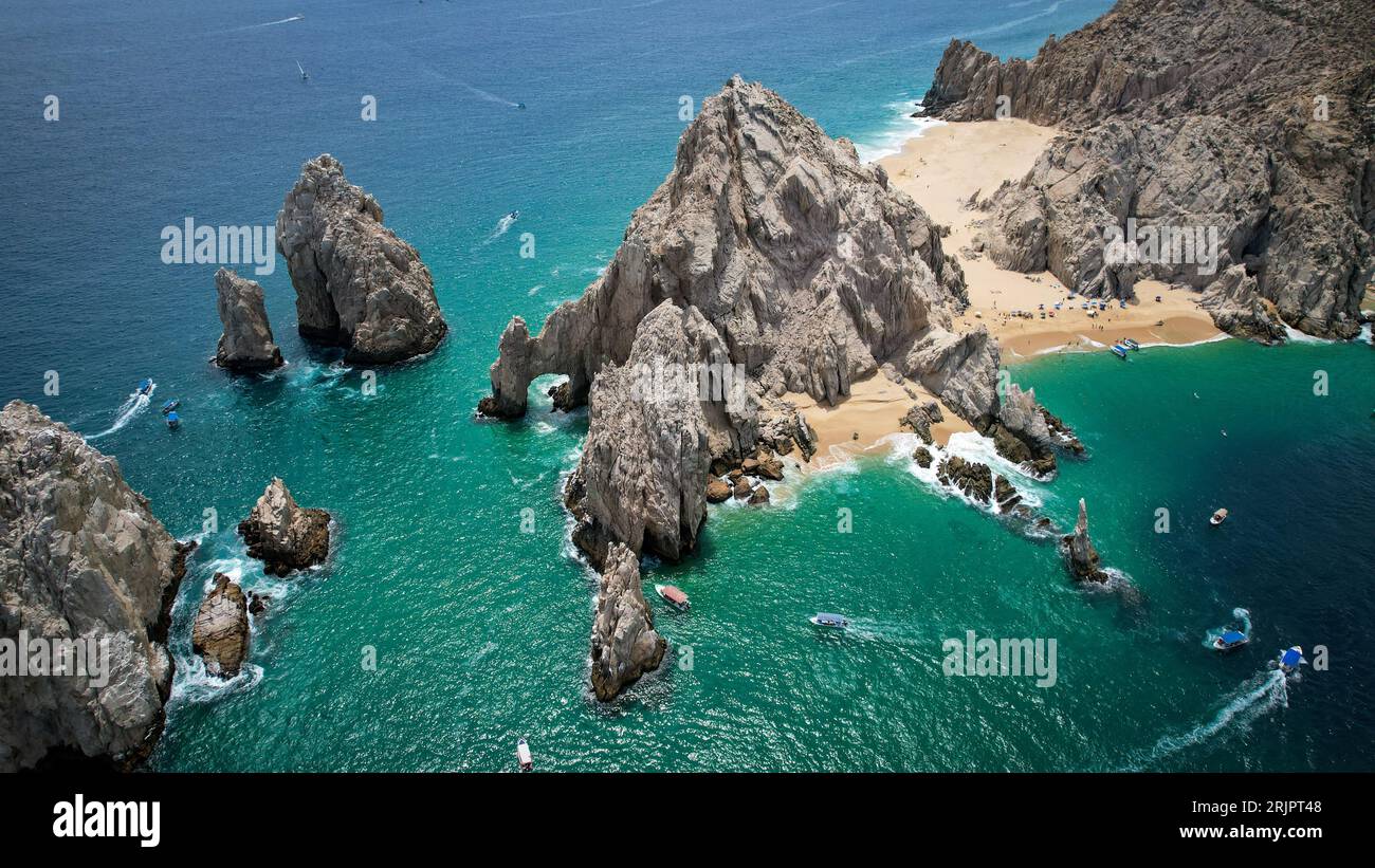 Aerial shot of the vast expanse of the ocean featuring multiple rocky ...