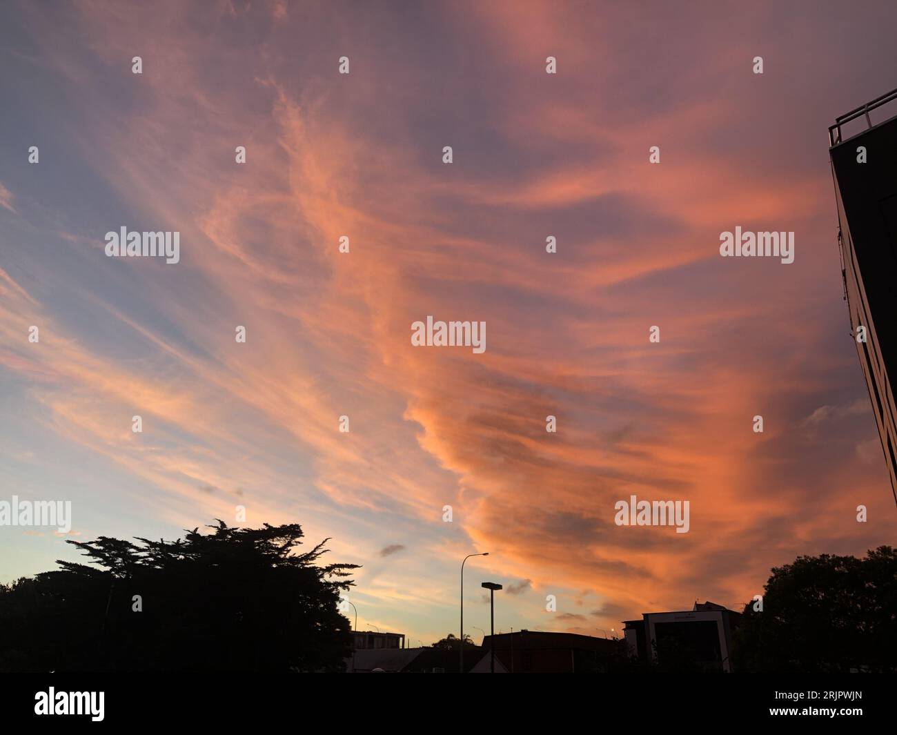 Radiating pink clouds hi-res stock photography and images - Alamy
