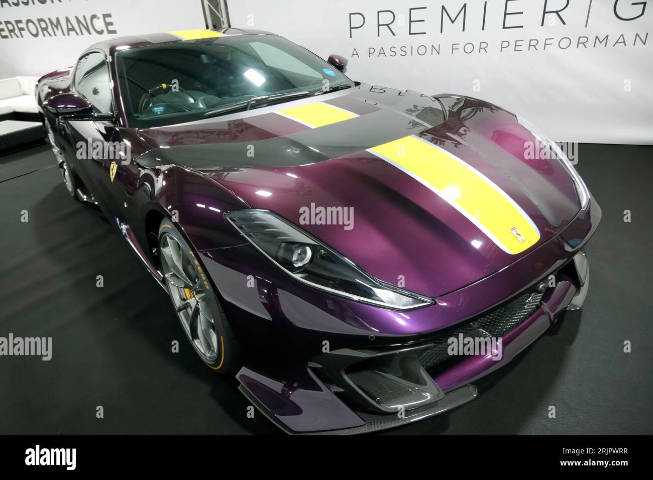 Three-quarter front view of a Ferrari 812 Competizione, on the Premier ...