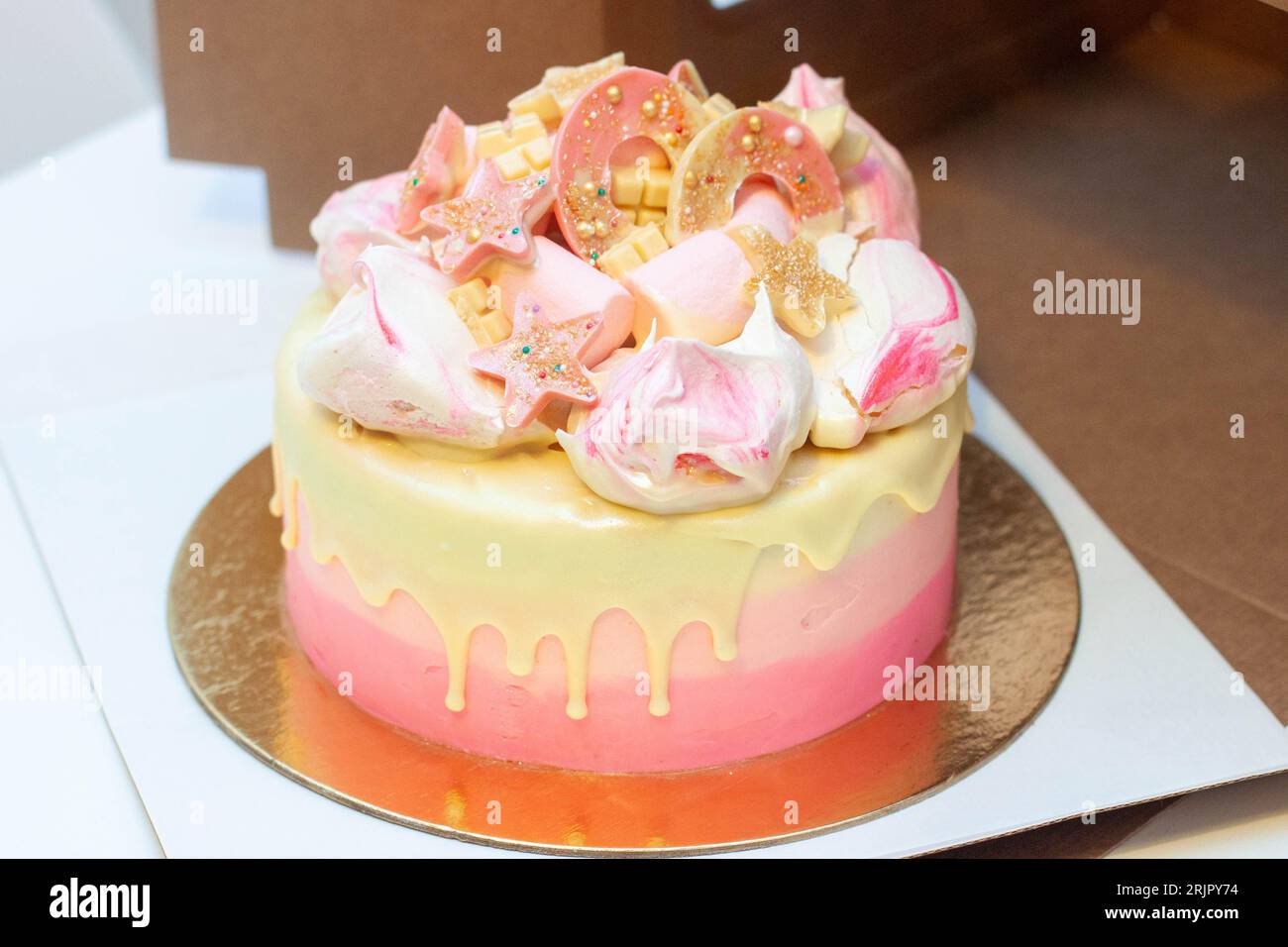 Birthday gradient pink cake with meringue clouds, chocolate donuts ...
