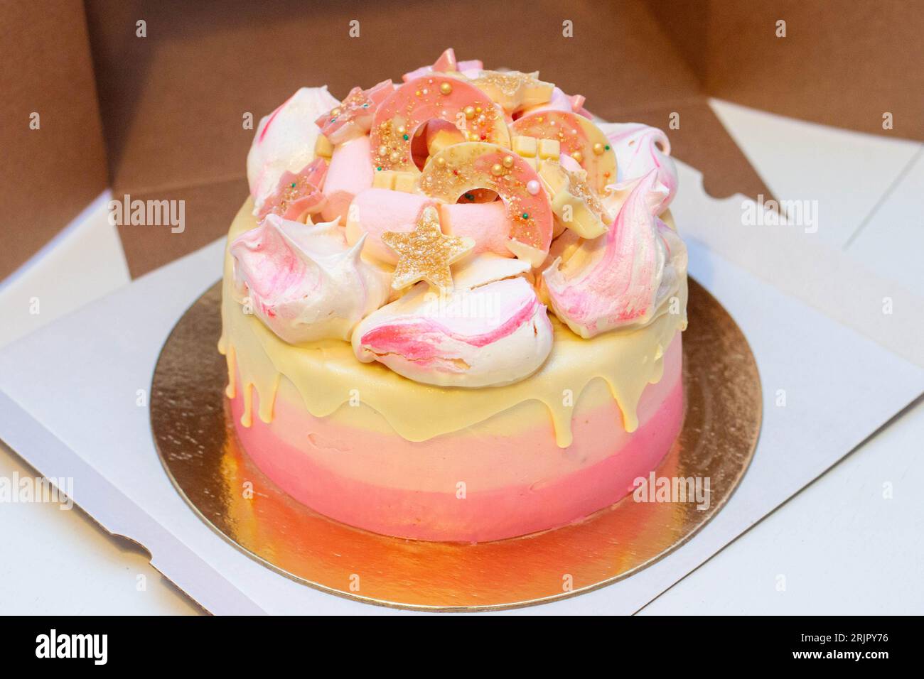 Birthday gradient pink cake with meringue clouds, chocolate donuts ...