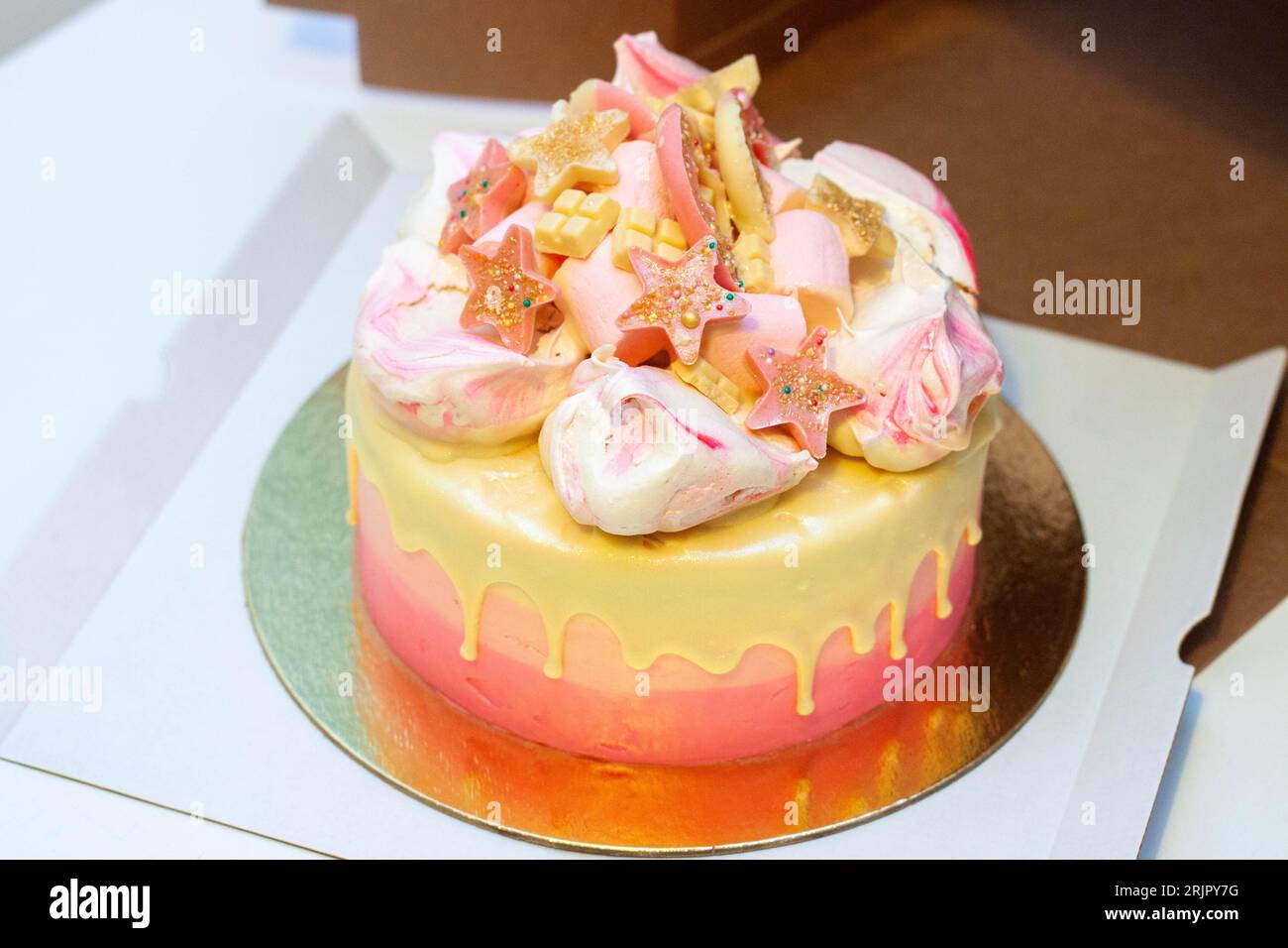 Birthday gradient pink cake with meringue clouds, chocolate donuts ...