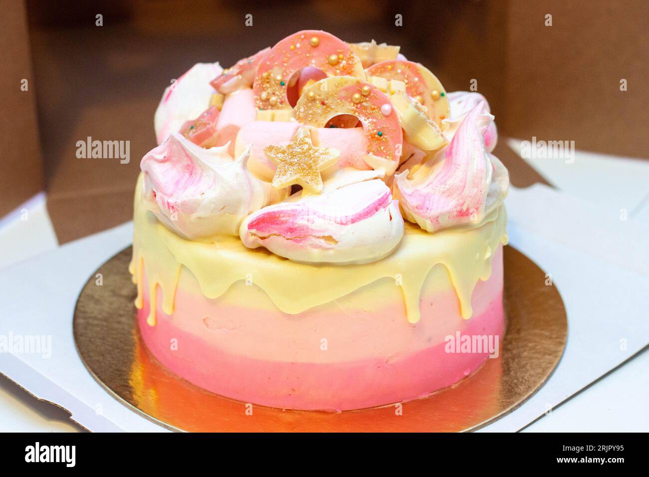 Birthday gradient pink cake with meringue clouds, chocolate donuts ...