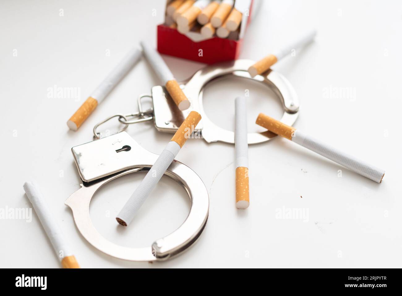 Addiction concept cigarettes handcuffs hi-res stock photography and ...