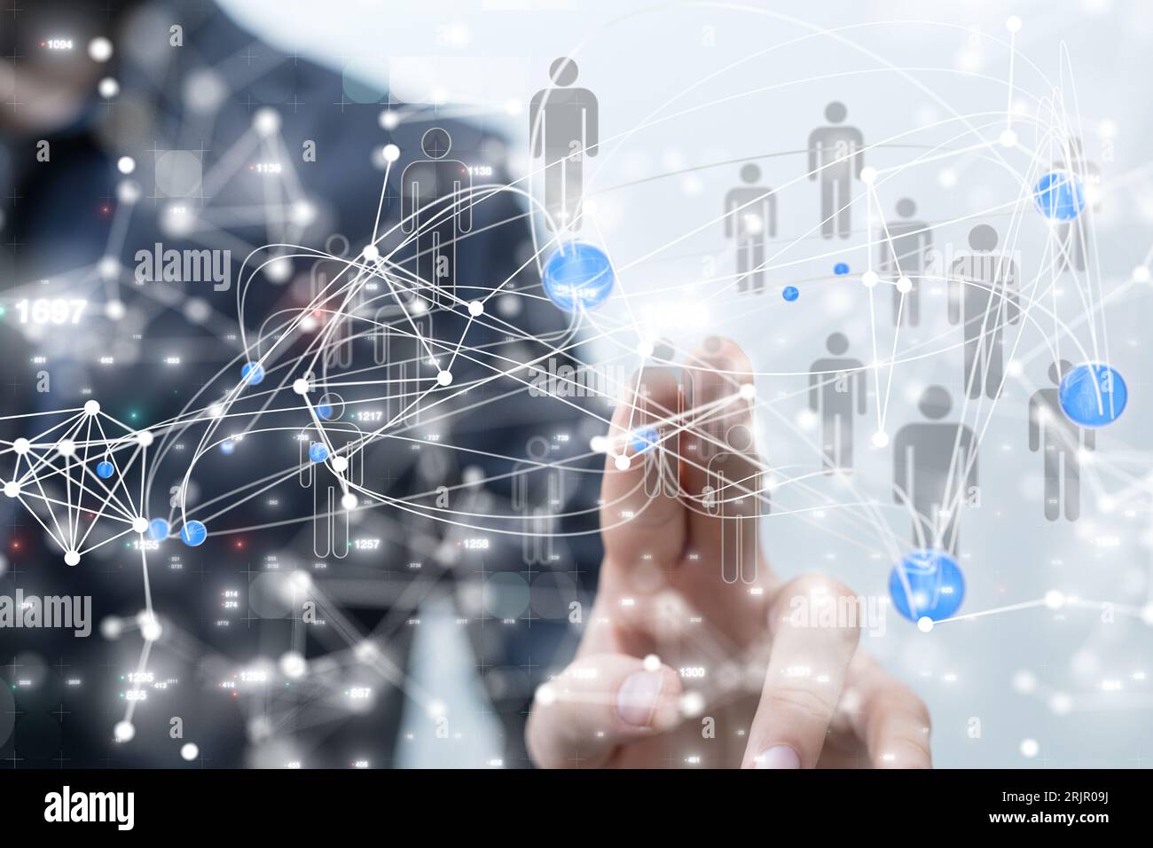 A businessman navigating a detailed hologram with gray people icons ...