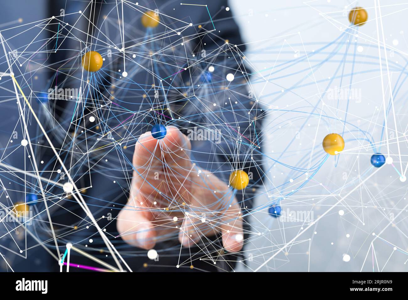 A hand touching a complex arrangement of interlinked spheres Stock ...