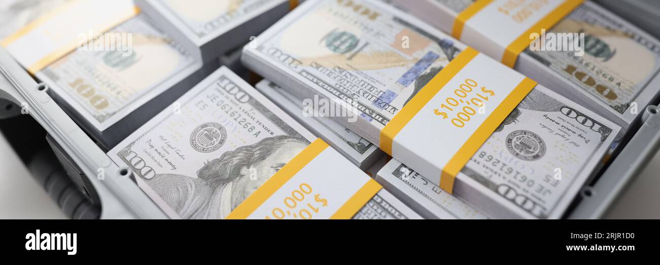 Briefcase full 100 dollar bills hi-res stock photography and images - Alamy