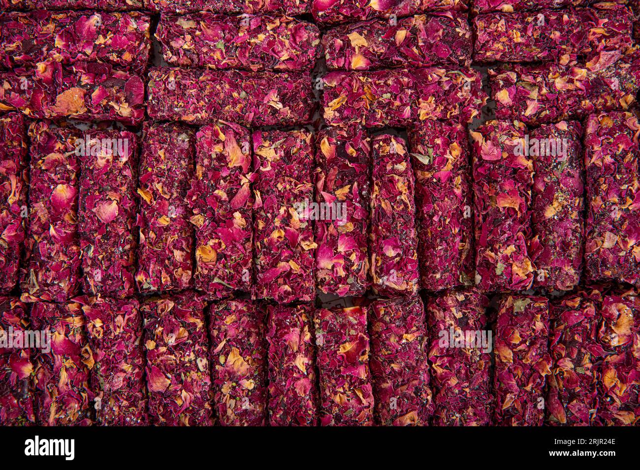 Sweet roll with pomegranate and nuts, turkish sweets. Mix of various ...