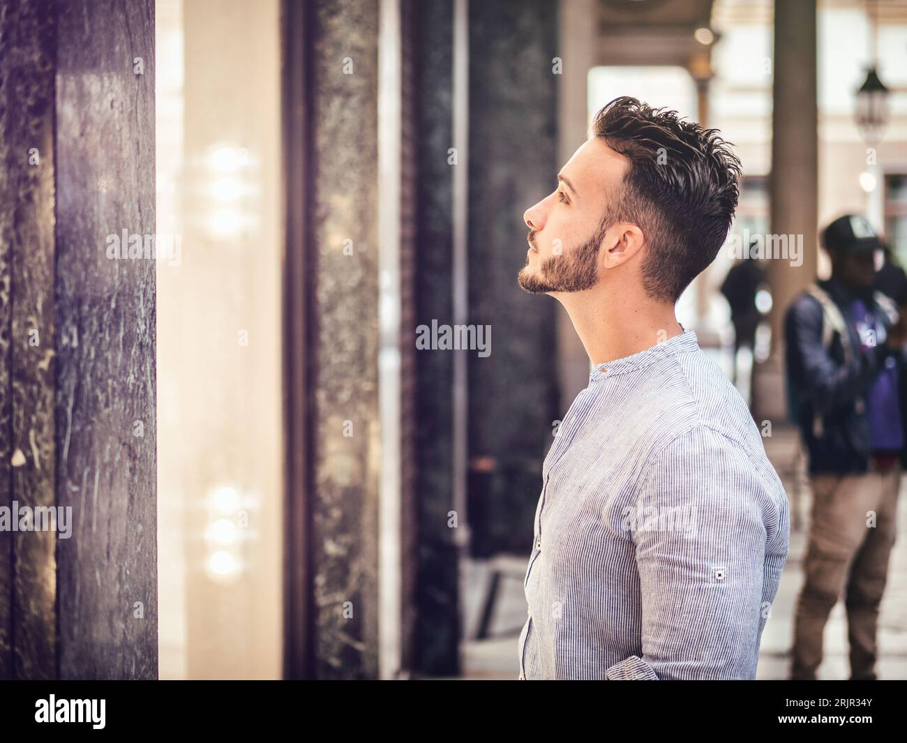 Facade building man standing hi-res stock photography and images - Alamy