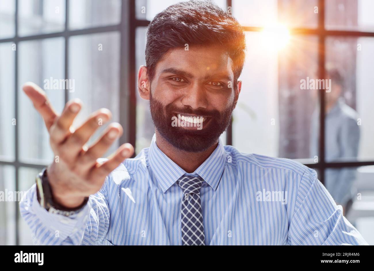 Person inviting you to shake hands before signing the document ...