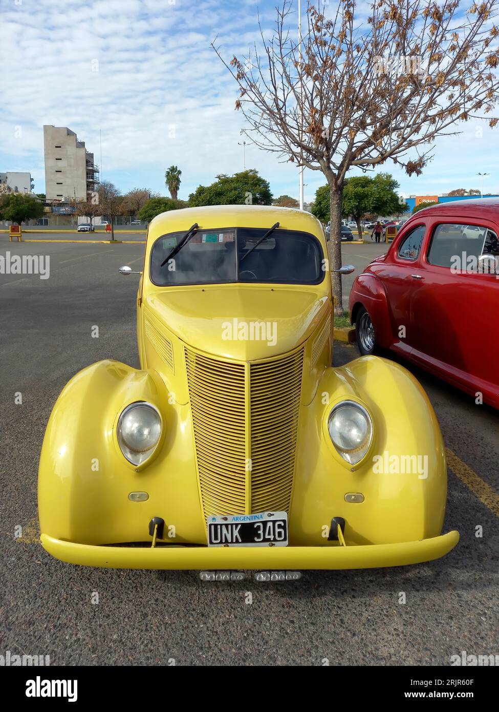Old yellow 1937 Ford V8 coupe 5 window street rod in a parking lot ...