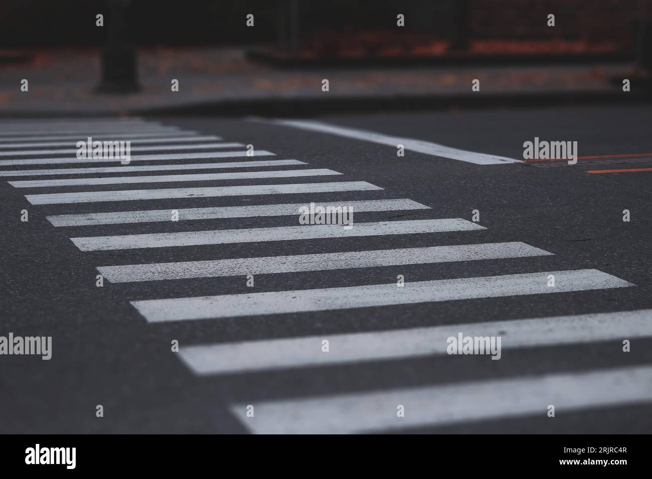 An asphalt road marked with white lines to signify a designated ...