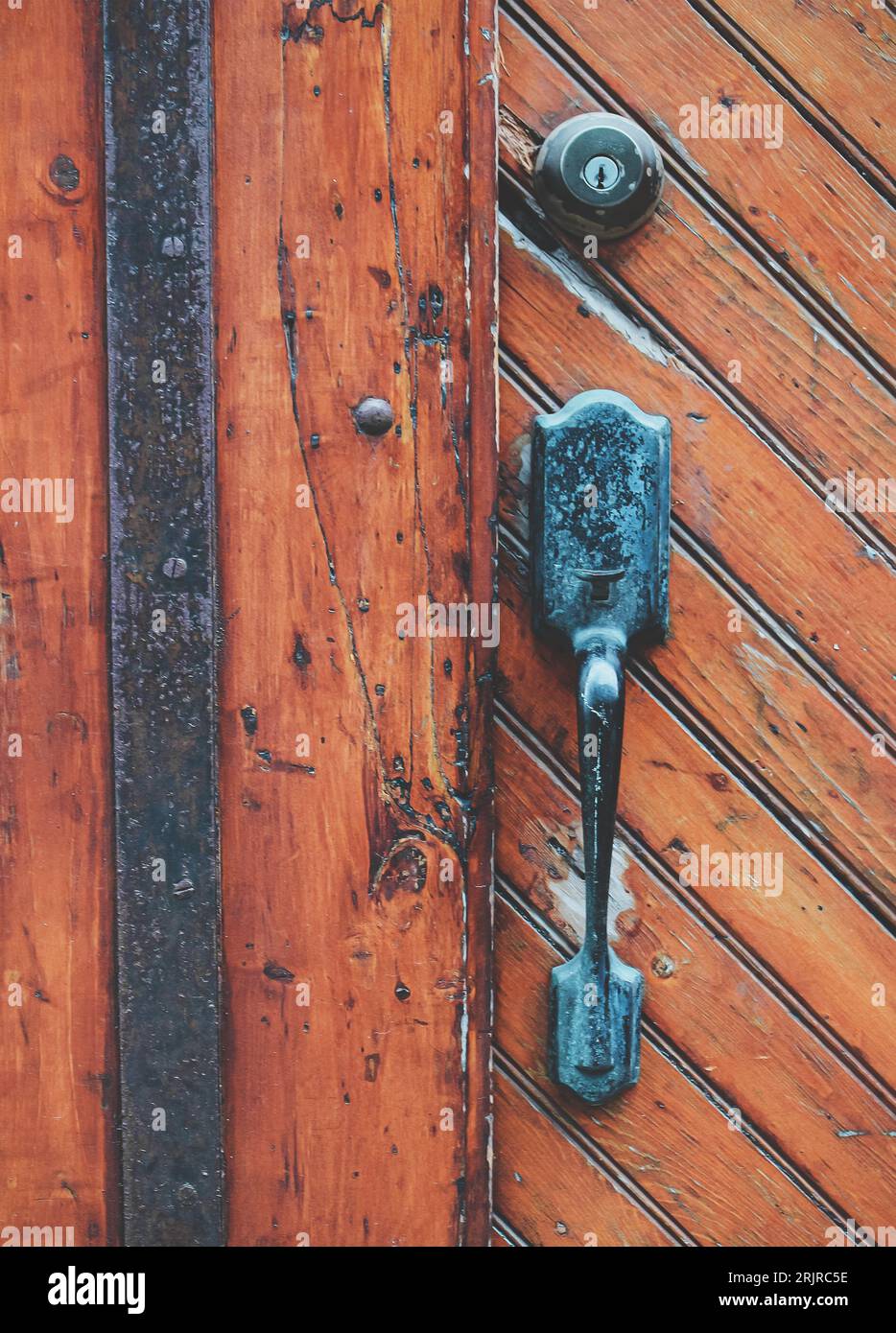 An antique wooden door featuring a classic rustic keyhole Stock Photo ...